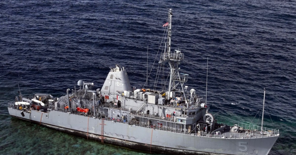 US Navy ship perched on Philippines coral reef