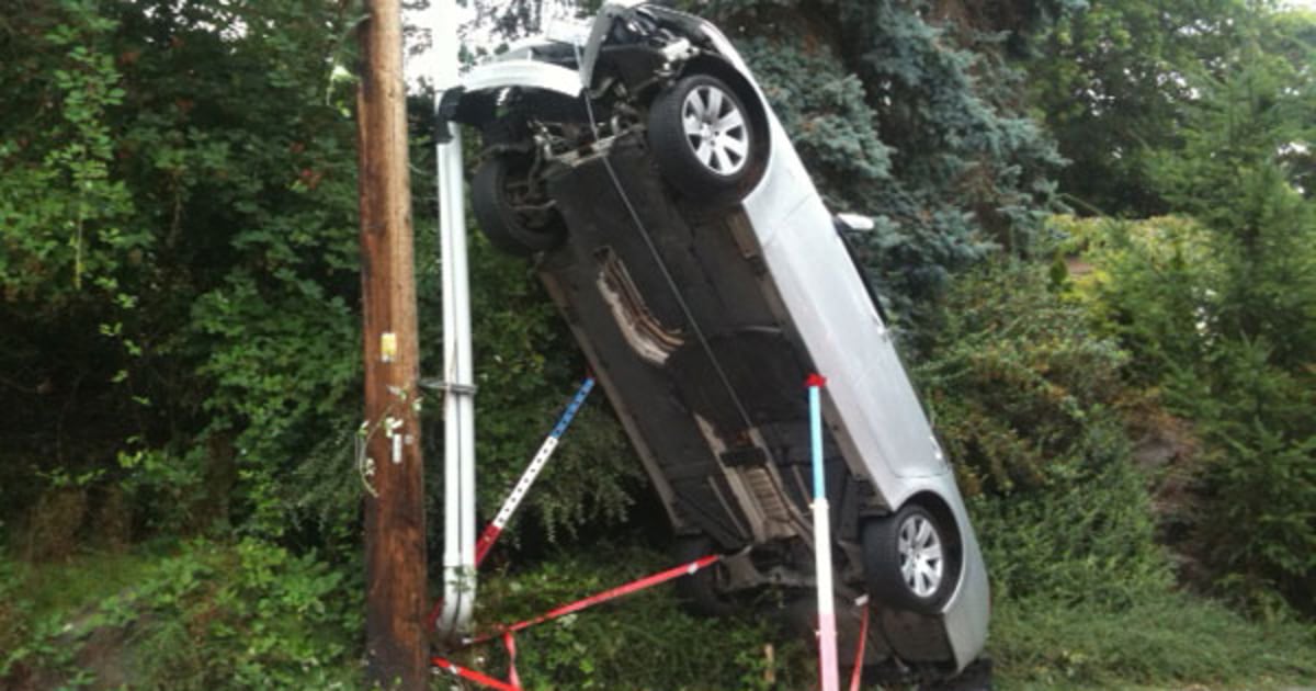 Car pulls off high-wire act in Wash. wreck