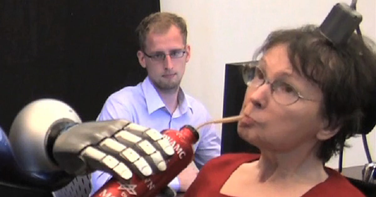Paralyzed woman moves robotic arm with her mind