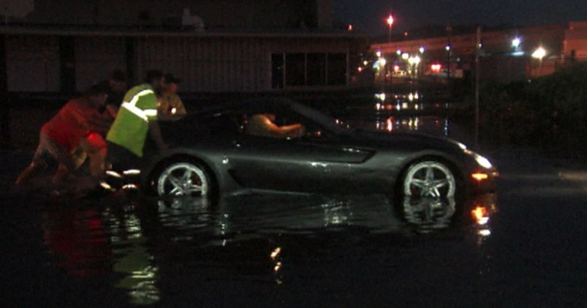 Bad decision: Driving a Ferrari through flood