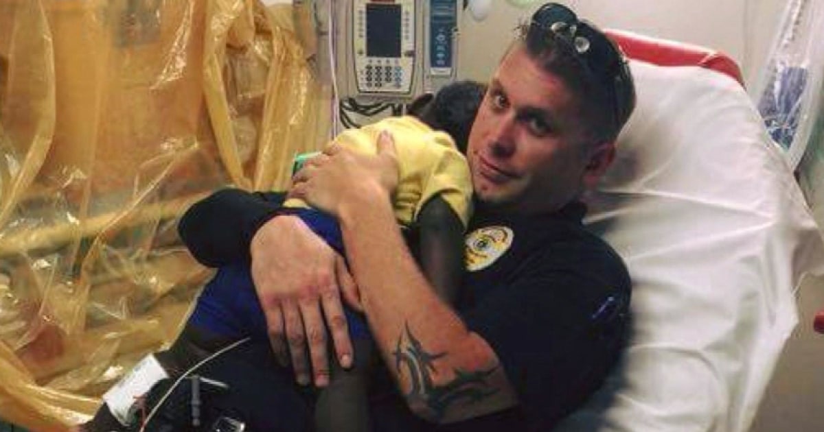 Photo Captures Cop Comforting Toddler