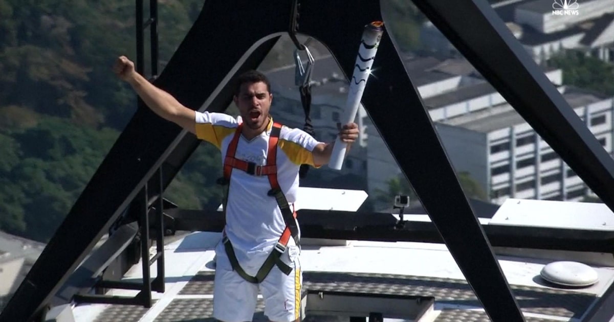 See Olympic Torch Carried on Roof of Cable Car