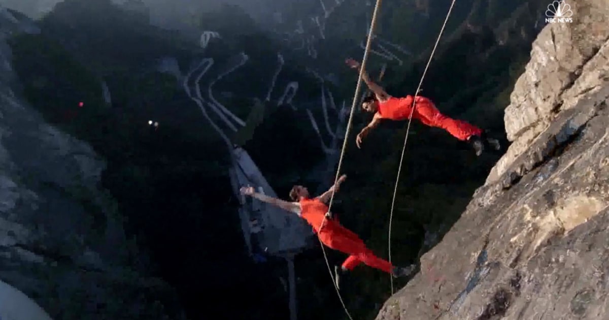 Watch Dancers Perform Suspended from Mountain in China