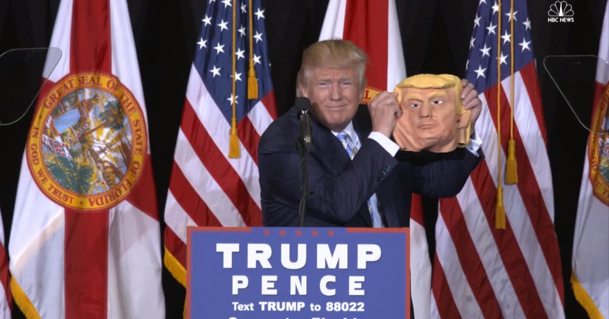Trump Admires Mask of Himself for its ‘Beautiful Head of Hair’