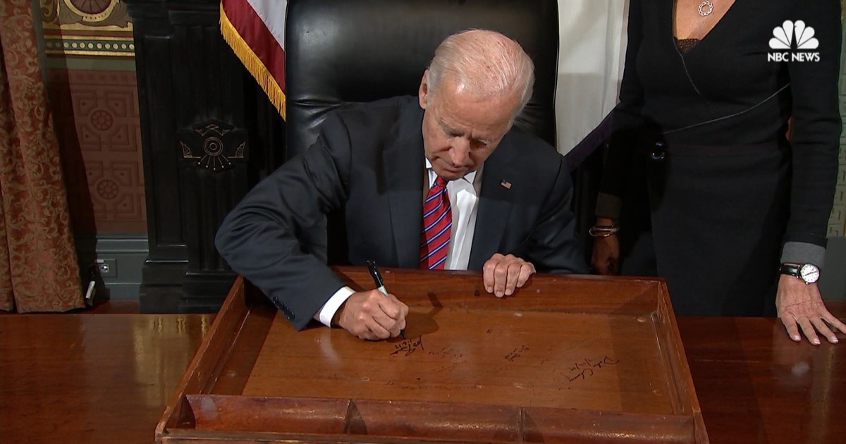 Joe Biden takes part in signing of ceremonial desk drawer
