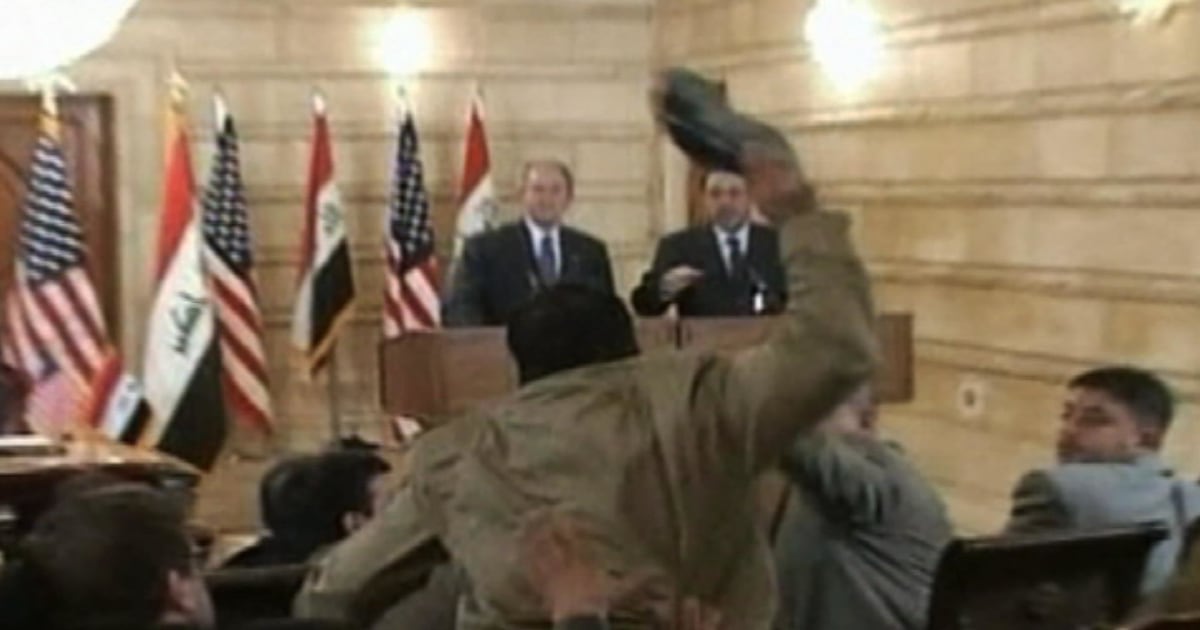 Iraqi journalist Muntazer Zaidi throws shoe at President George W. Bush