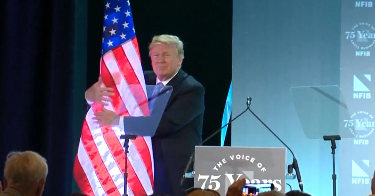 Donald Trump hugs American flag after immigration policy comments