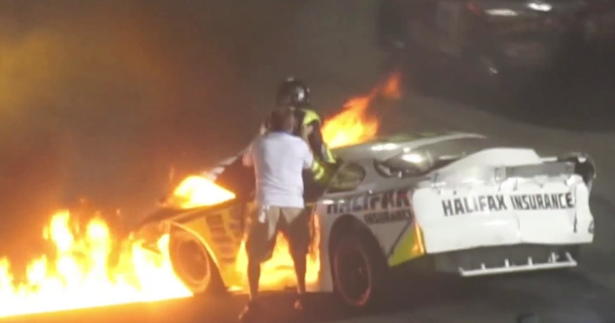 Father pulls son from burning car after dramatic racetrack crash