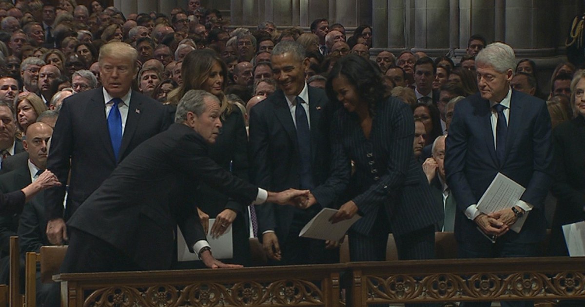 George W. Bush gives Michelle Obama candy again at father's funeral