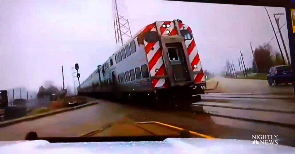 Video shows scary close-call between train and police vehicle