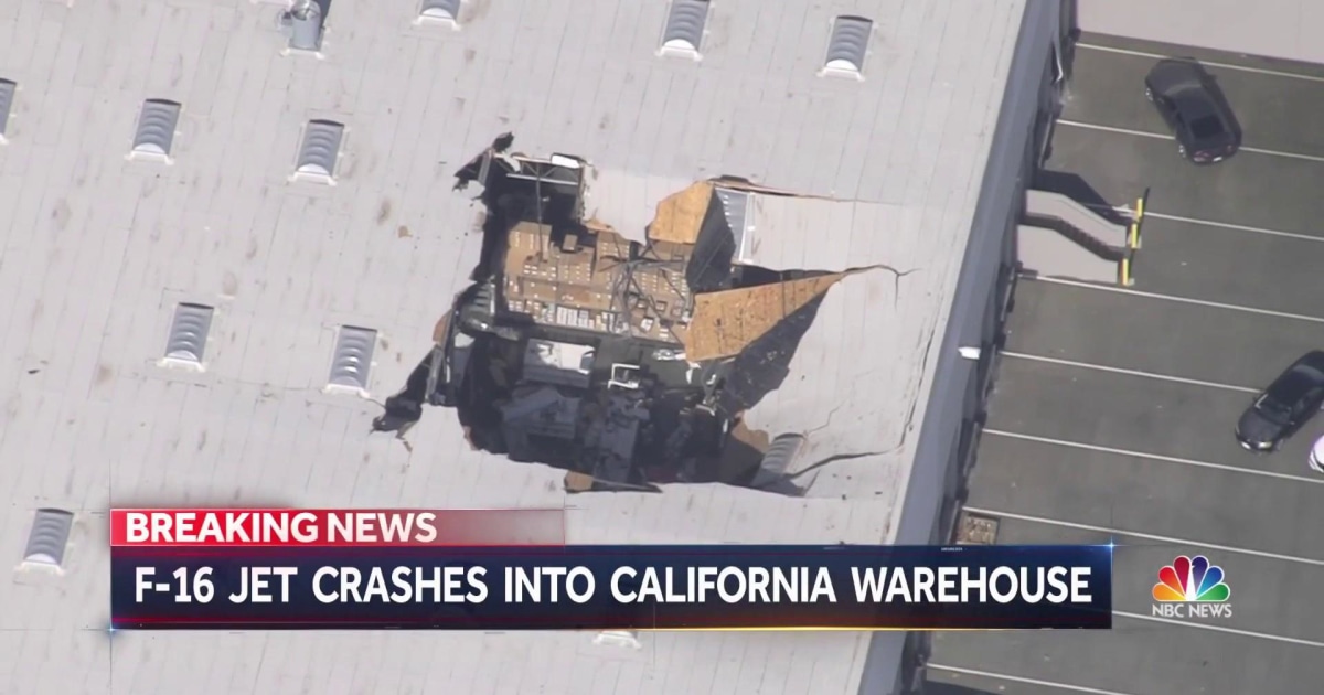Military jet crashes into California warehouse