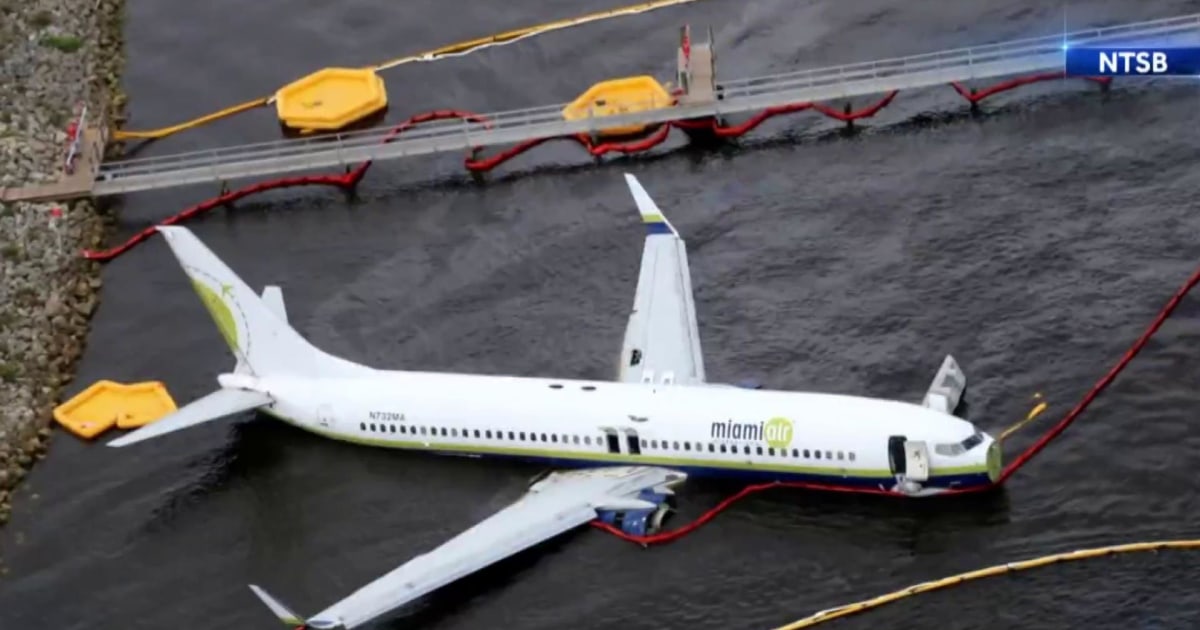 Boeing 737 slides off Florida runway and into river