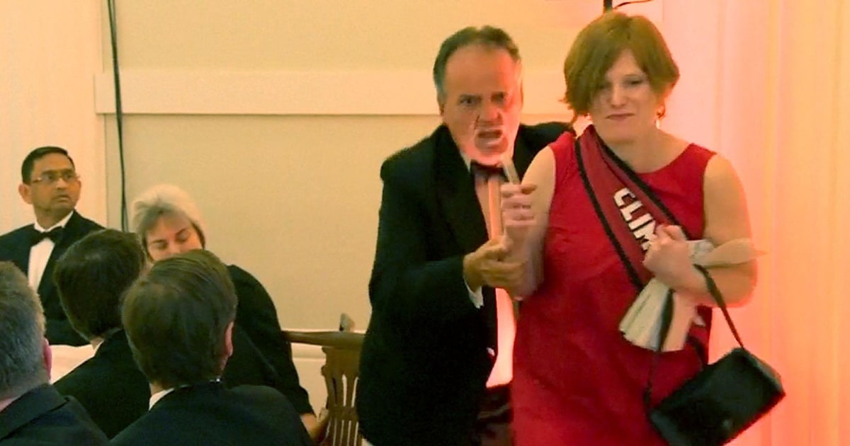 U.K lawmaker Mark Field grabs climate change activist at black-tie protest