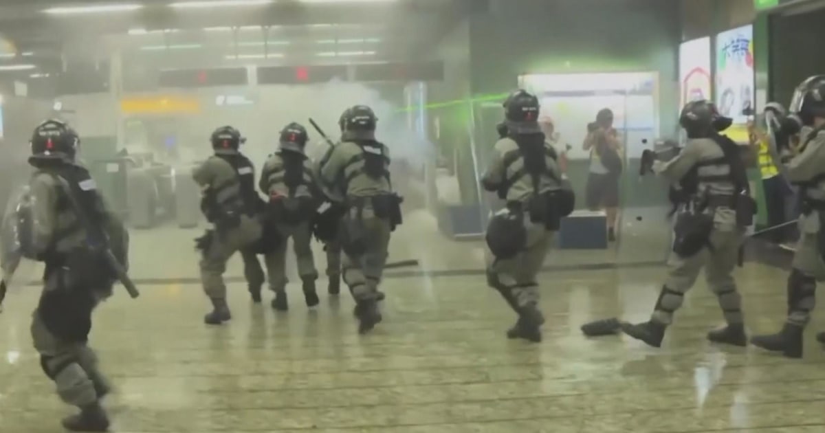 Hong Kong police fire tear gas inside train station