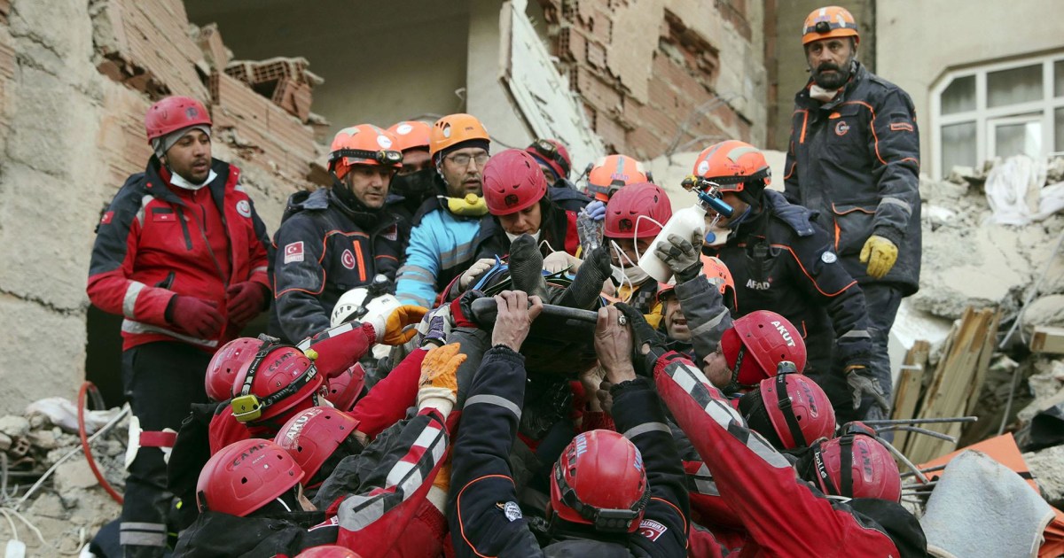 Rescuer uses phone to speak to people trapped under rubble in Turkey