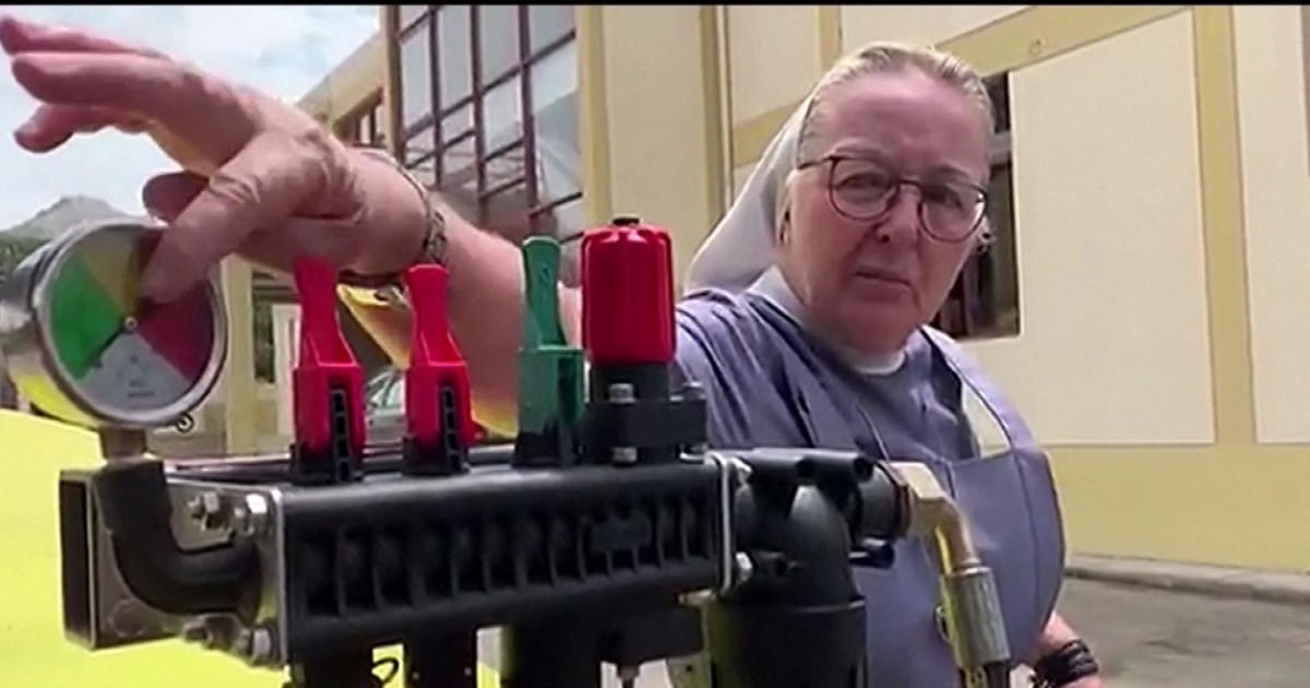 Nun drives farm tractor spreading disinfectant to combat COVID-19