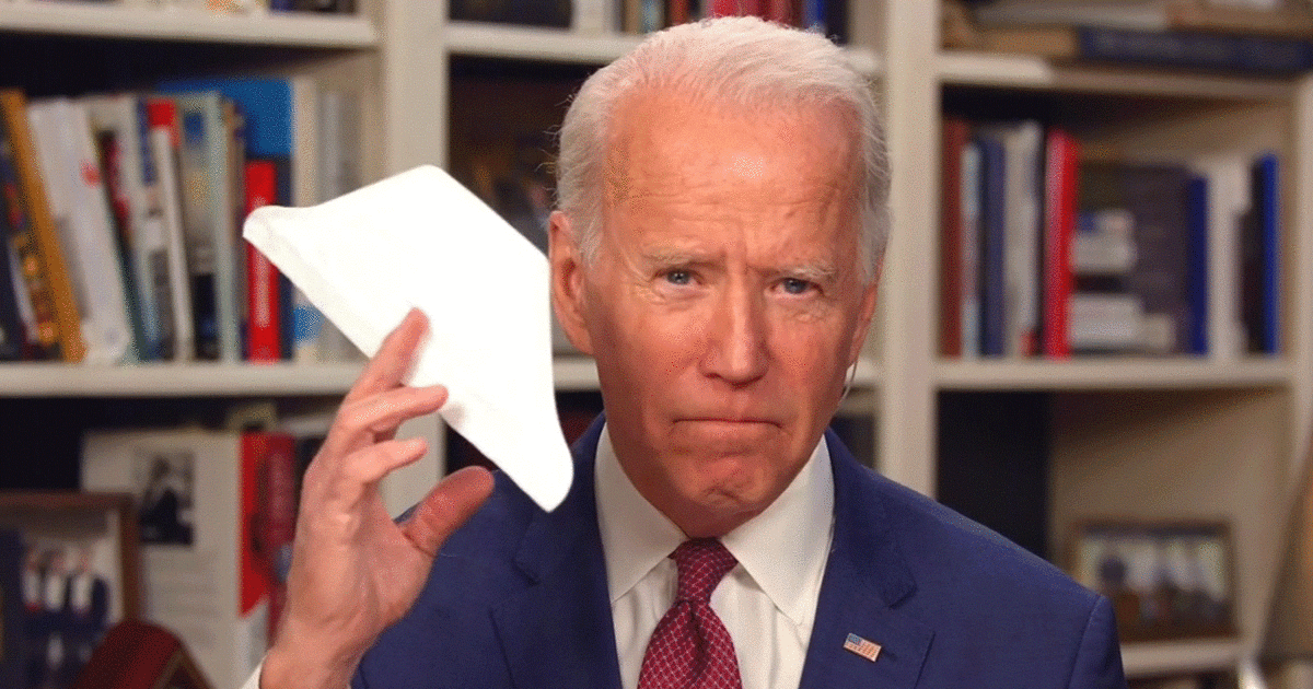 Biden shows off face mask at home