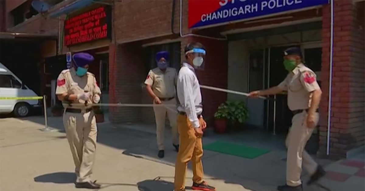 Indian police use pole to social distance while capturing lockdown ...