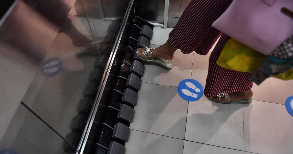 Bangkok shopping mall unveils virus-safe foot-operated elevators