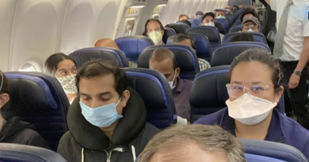 Photos of packed passenger planes amid coronavirus pandemic spark outrage