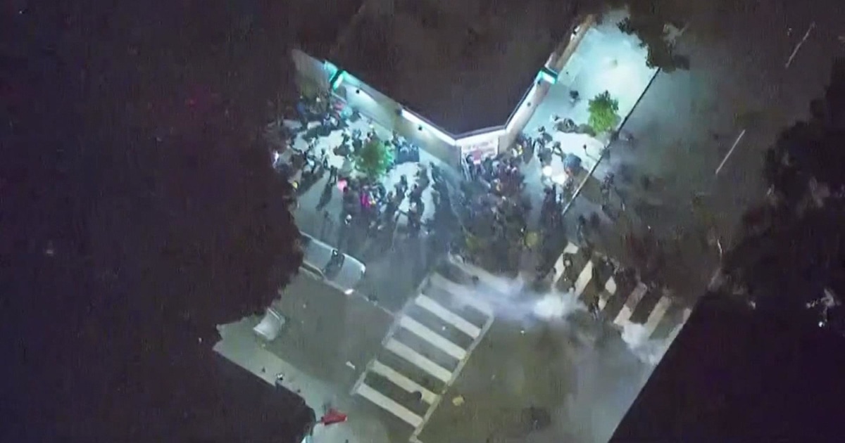 Flash-bang grenades scatter crowd on streets of Portland, Oregon