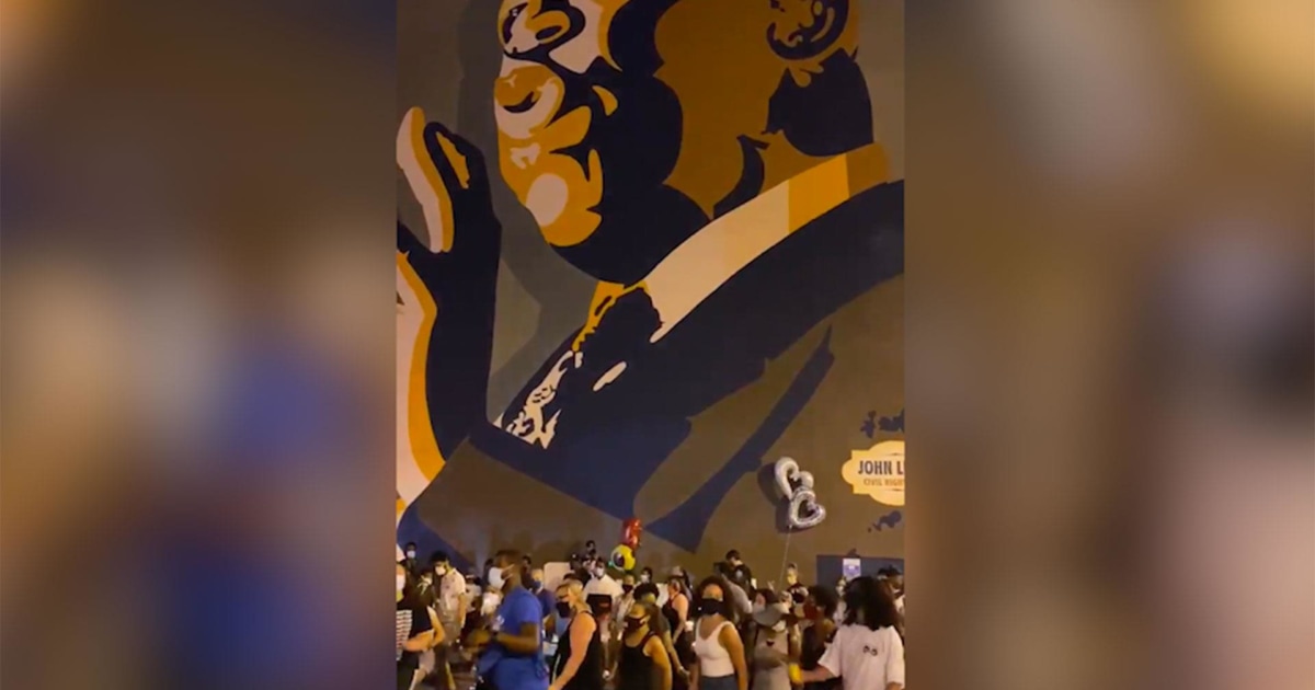 Crowd gathered at Rep. John Lewis mural dances to Electric Slide