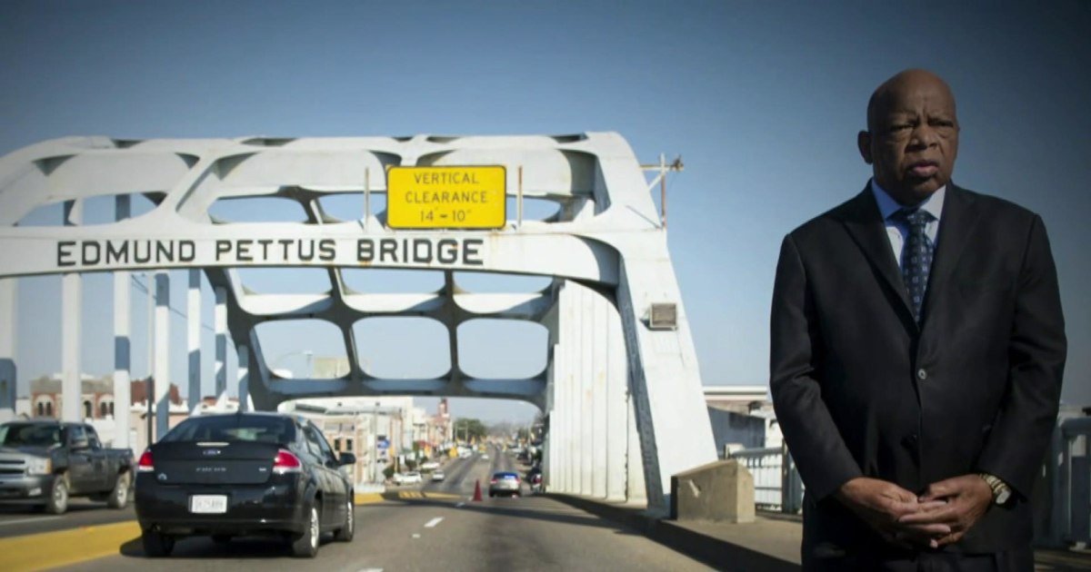 Rep. John Lewis crosses the Edmund Pettus Bridge one last time