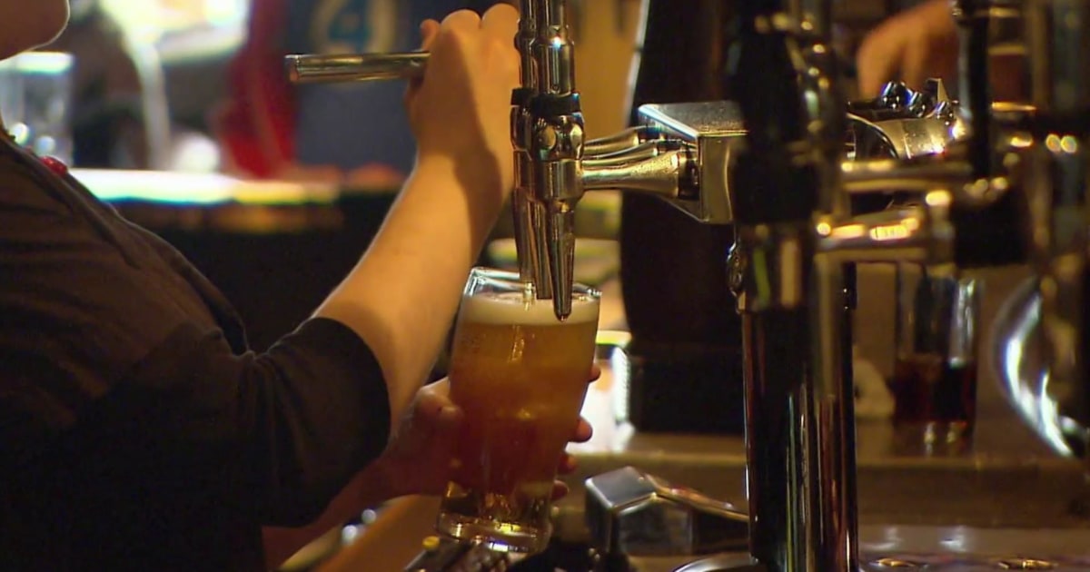 Cheer and caution as England reopens pubs amid coronavirus pandemic