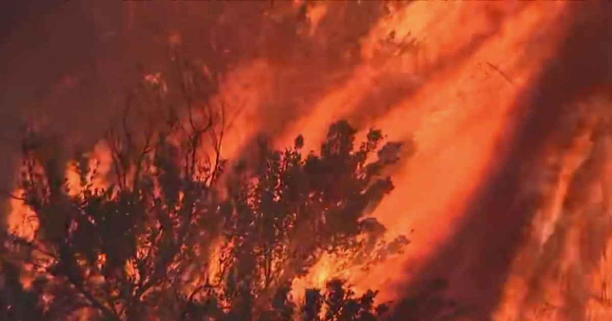 Powerful wind fuels California wildfires, tens of thousands evacuate