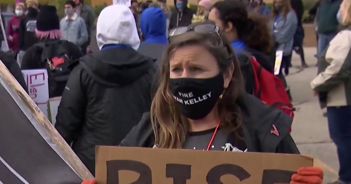 Dueling Michigan rallies stir divisiveness, each group heavily armed