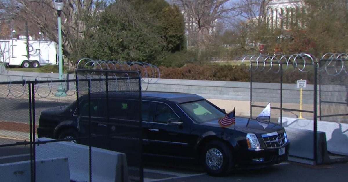 Biden's motorcade passes security gates and razor wire fencing in ...