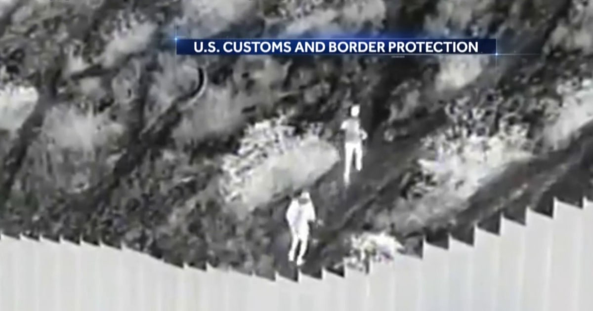 Shocking video shows migrant children dropped over border fence