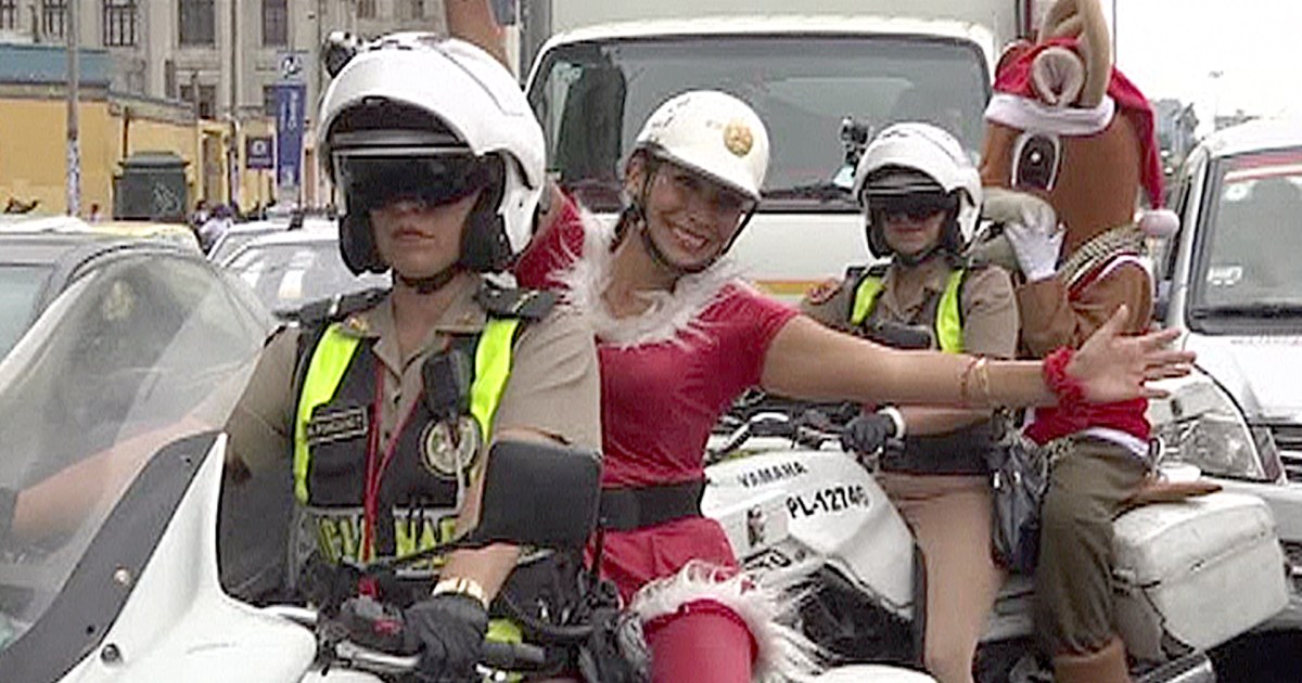 Police Officers Patrol City Dressed as Santa