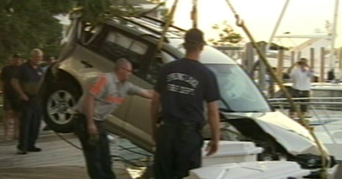 SUV crash lands on docked boat