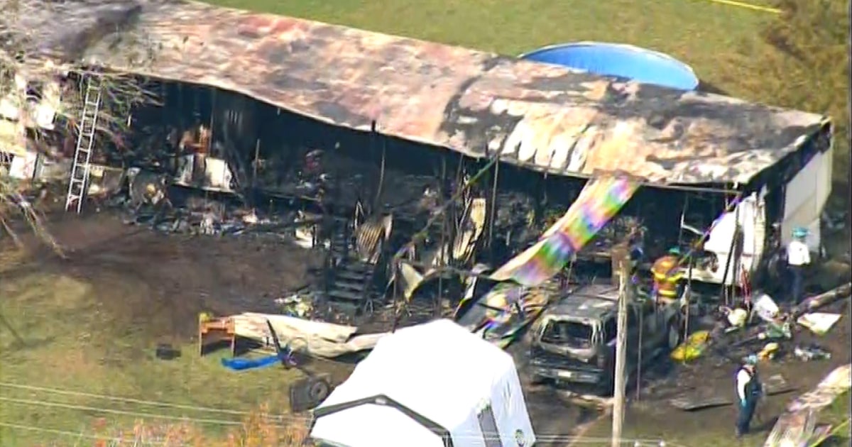 Investigators Work Scene of Deadly Mobile Home Fire