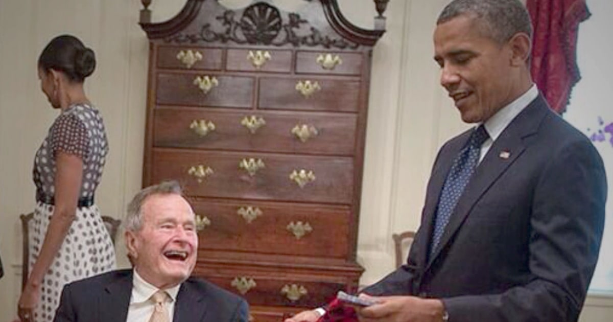 Bush shares his love of colorful socks with Obama