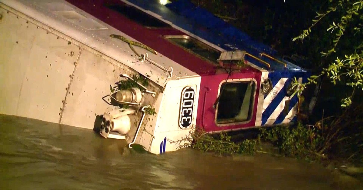 Rail Car Plunges Into Creek as Commuter Train Derails