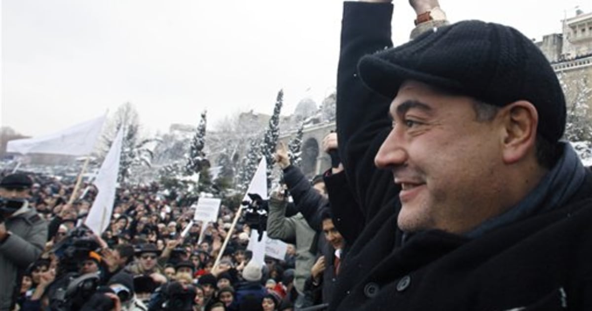 Georgia’s leader re-elected, but protests follow