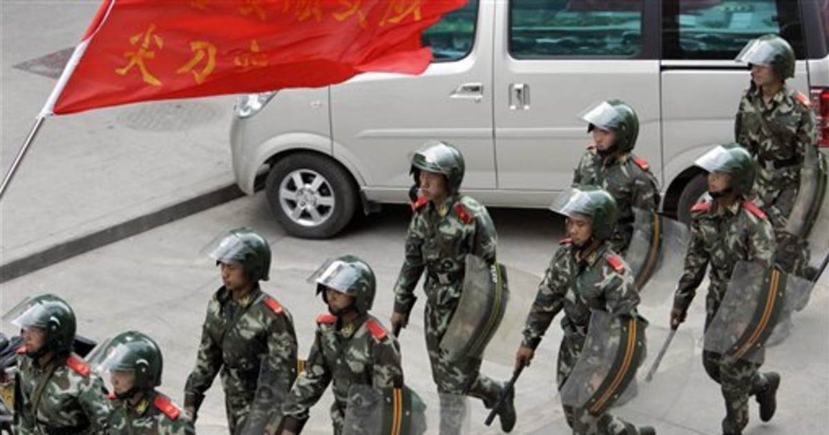Police swarm Chinese town after riots