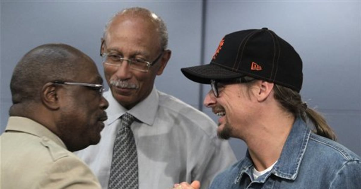 Kid Rock presents checks to 5 Detroit-area groups