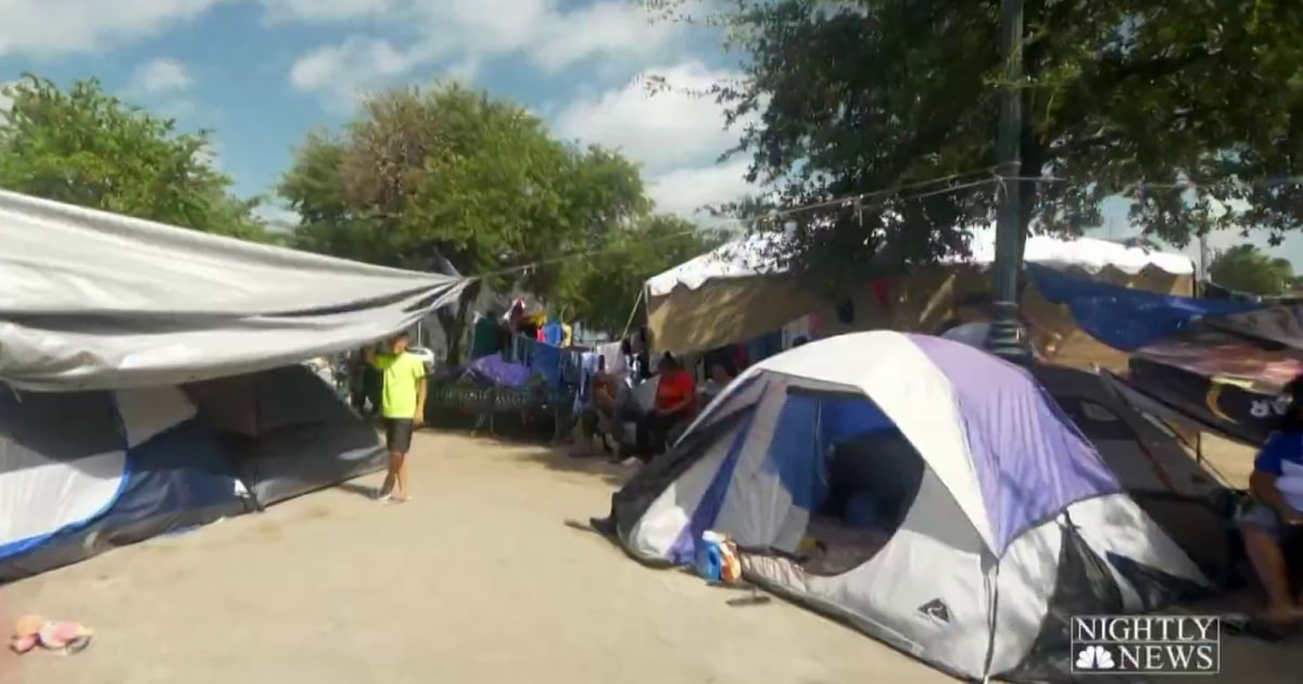 Growing tent camp houses hundreds of migrants near U.S. border