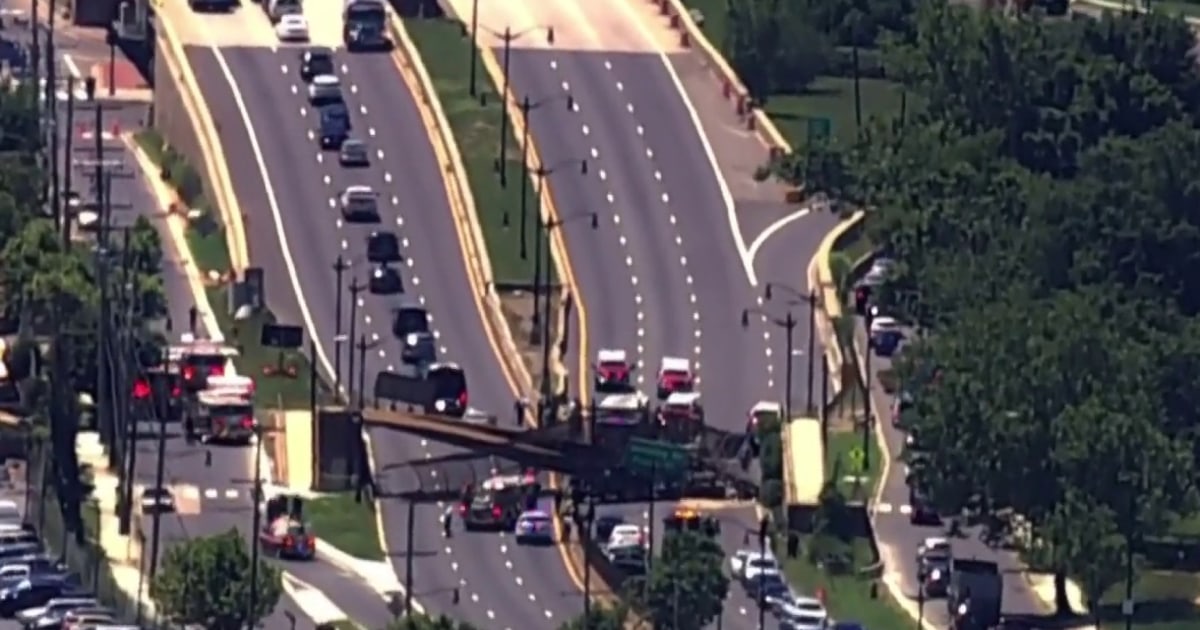Three injured after pedestrian overpass collapses onto road in Washington