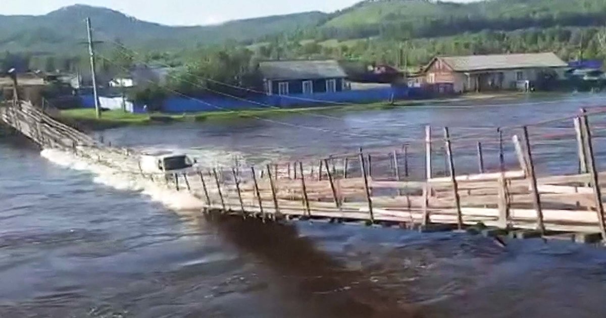 Bridge collapse flips truck into flooded Russian river
