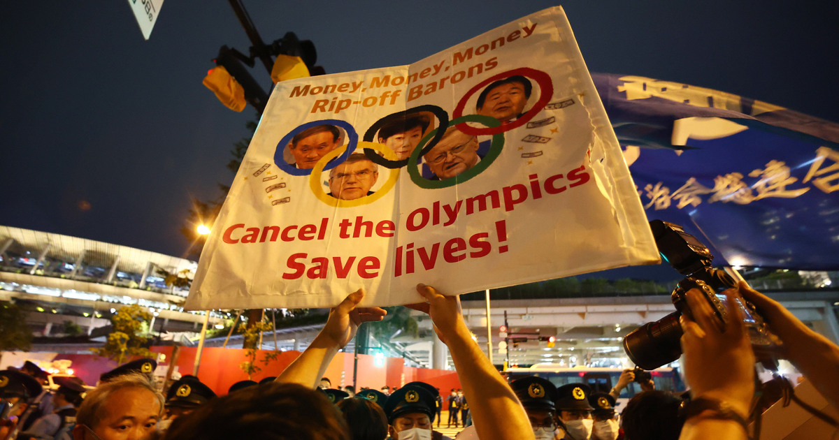 Anti-Olympic protesters march in Tokyo as opening ceremony begins