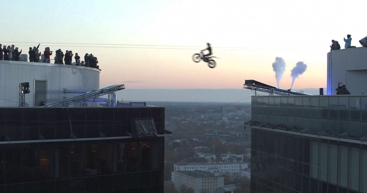 Estonian daredevil jumps motorbike between two skyscrapers