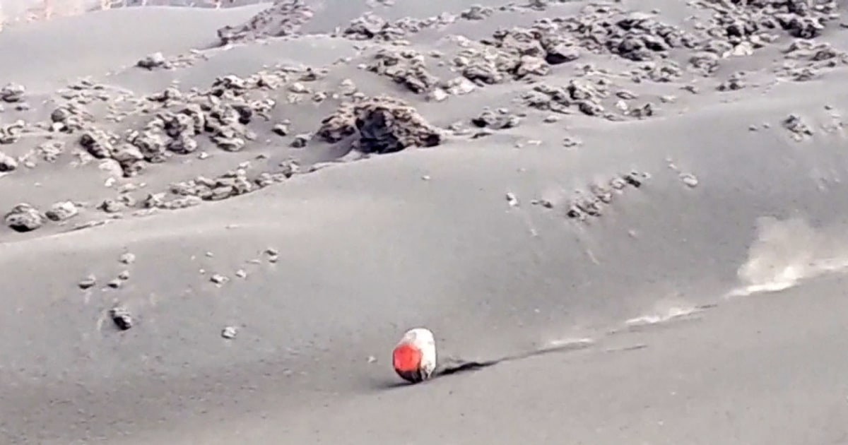 'Lava bomb' rolls down side of Spanish volcano