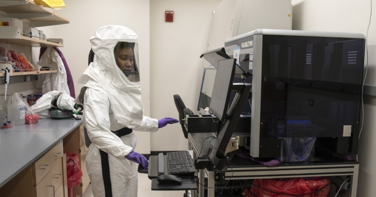 Scientists work to trace Covid omicron variant origin as global cases rise