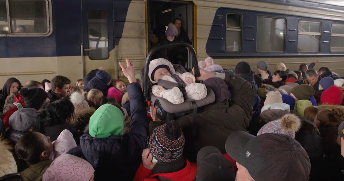 Terrified crowds rush to escape Kyiv by train as Russian attack intensifies