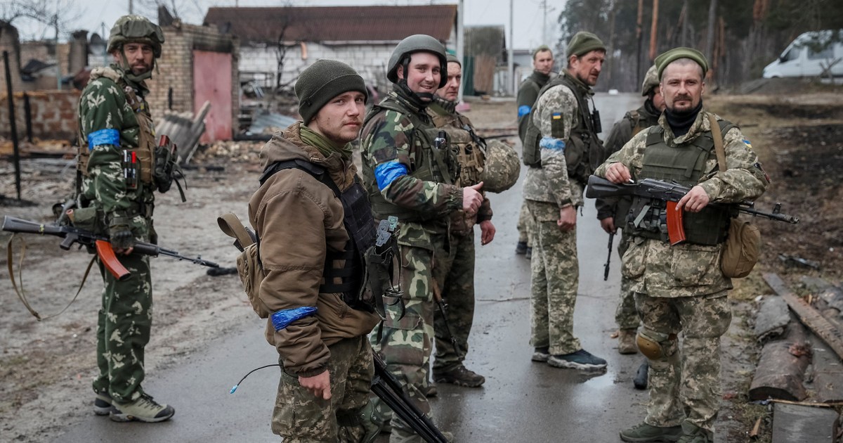 Ukrainian soldiers patrol Kyiv outskirts recaptured from Russia troops