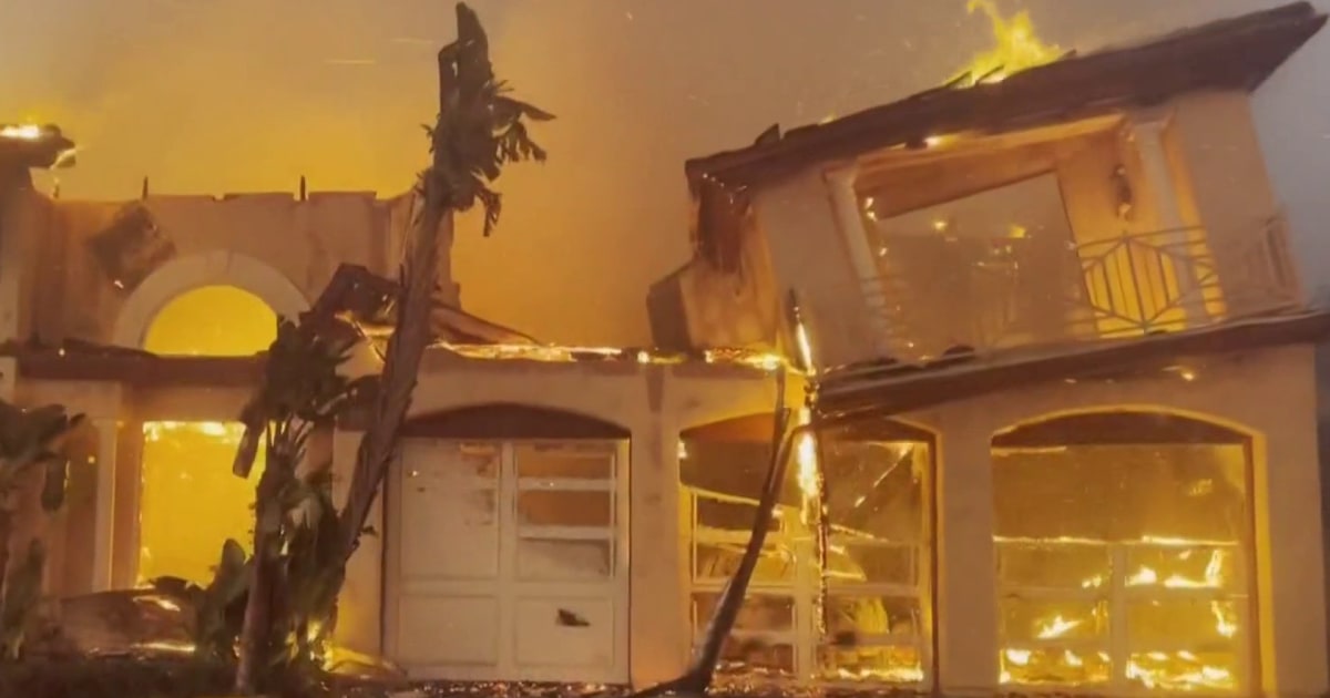 Dozens of homes destroyed as enormous wildfire scorches Southern California